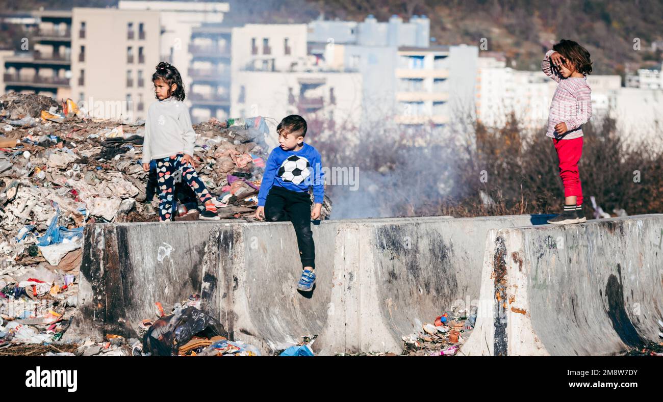 The poor children near the pile of trash in a Romanian hellhole Stock ...