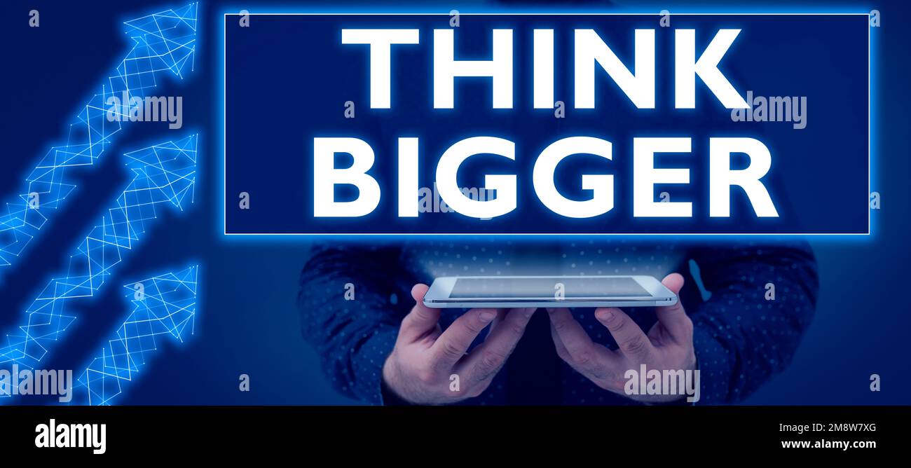 Hand writing sign Think Bigger. Internet Concept being able to dream ...
