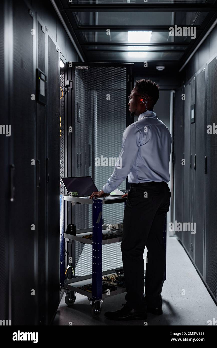 Data center technician using artificial hi-res stock photography and ...