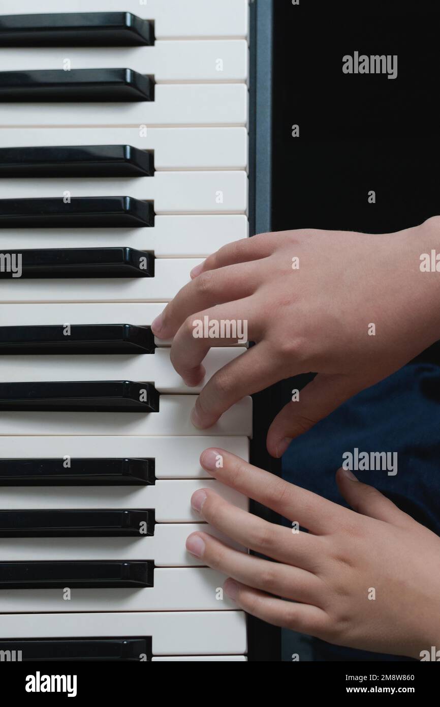 Music school. Piano chords two hands playing exersizes. Keys on the ...