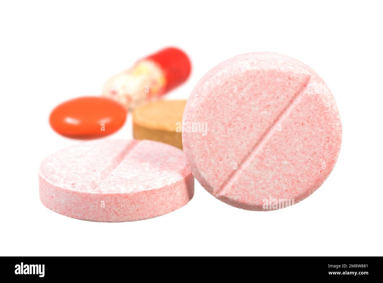 Different pills close-up on white Stock Photo - Alamy