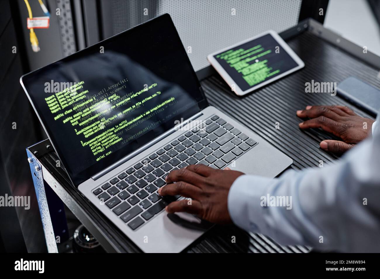 Technician using laptop in high hi-res stock photography and images - Alamy