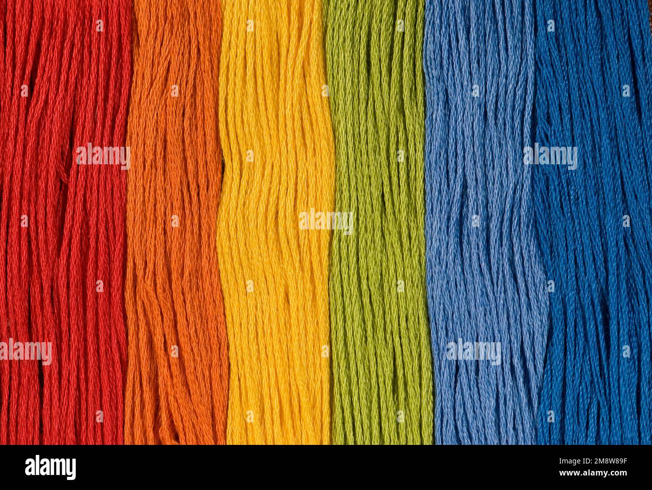 Rainbow spectrum color embroidery threads background Stock Photo - Alamy