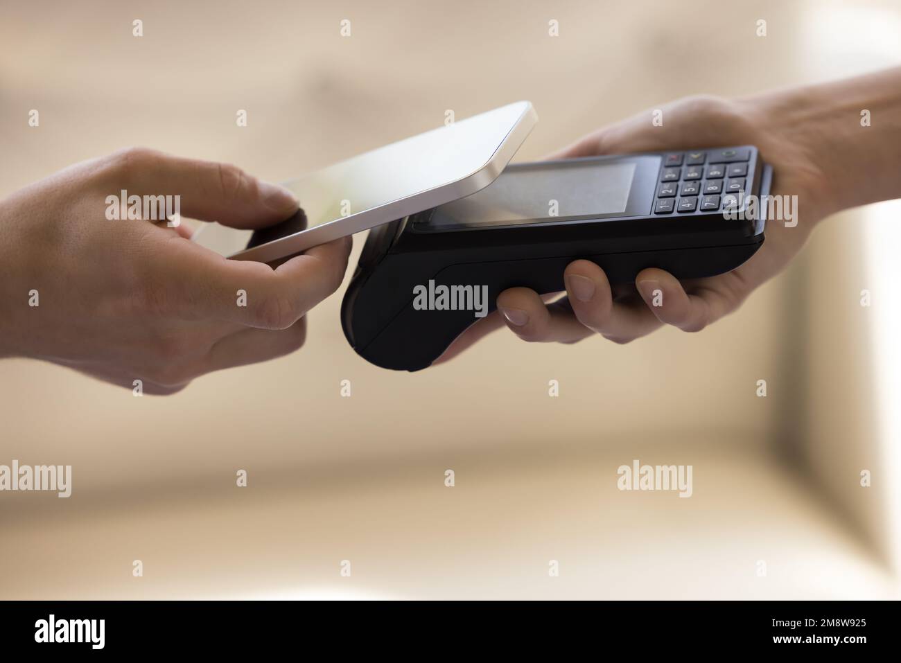 Contactless payment POS terminal and smartphone in human hands Stock ...