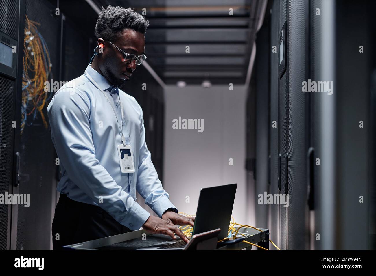 Backlit side view portrait of data engineer wearing formal uniform ...