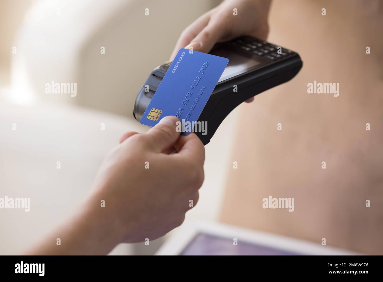 Young adult paying in bank hi-res stock photography and images - Alamy