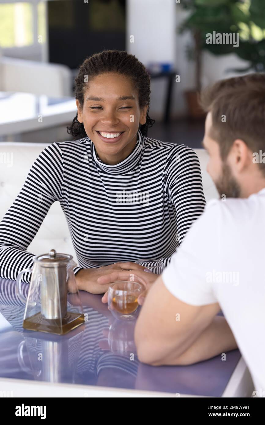Back view of black man sitting at table hi-res stock photography and images - Alamy