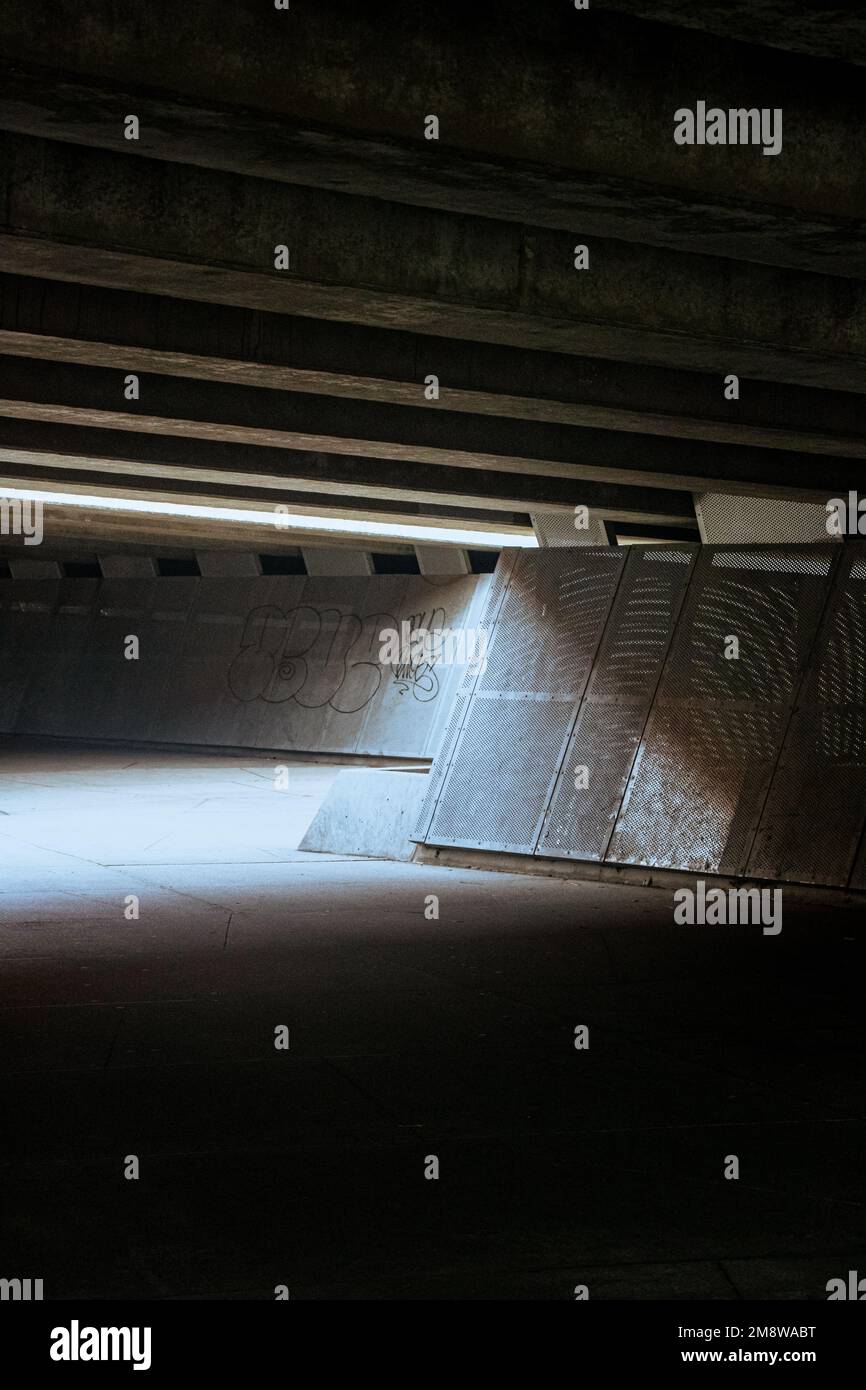 a poorly lit underground tunnel Stock Photo - Alamy