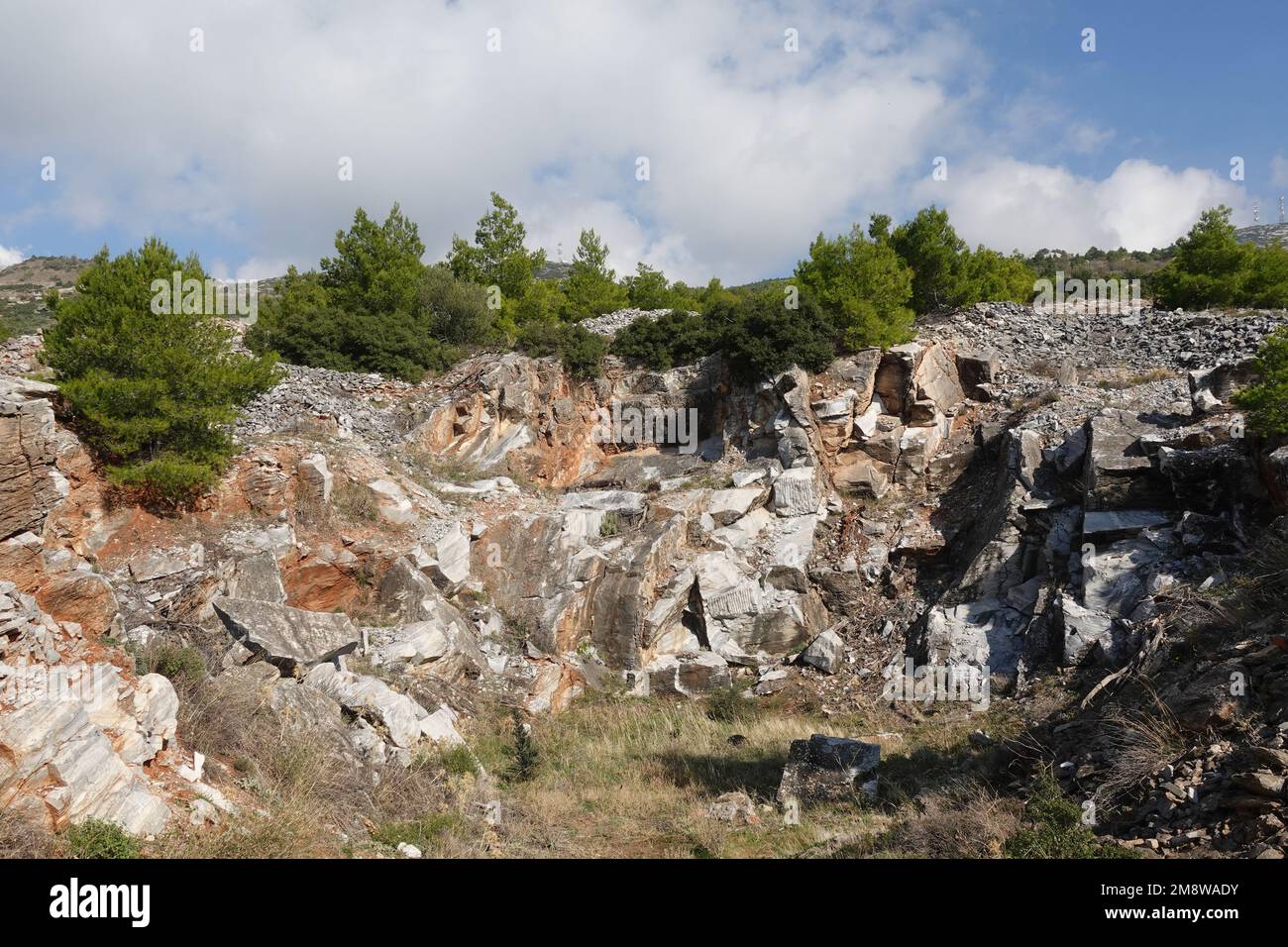 Mountain slope with natural marble stones metamorphic rock. Old disused ...