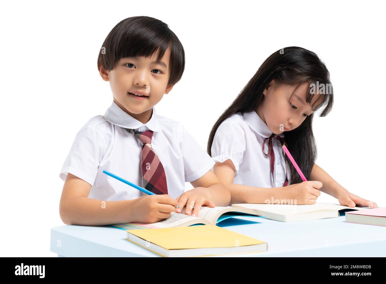 The little boy and little girl in the study Stock Photo - Alamy