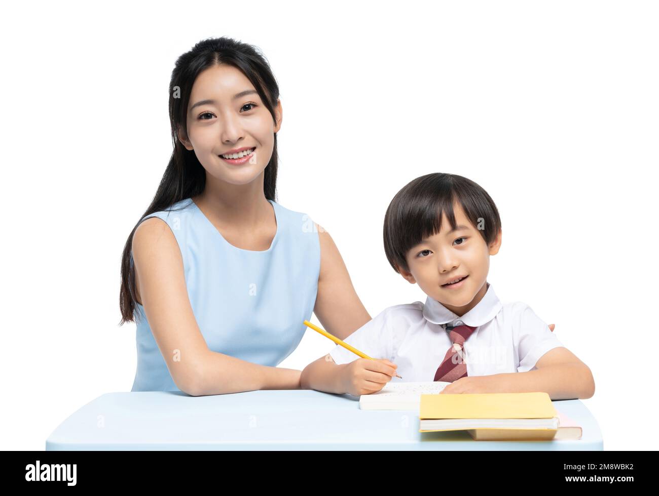 A young female teacher counseling boy learning Stock Photo - Alamy