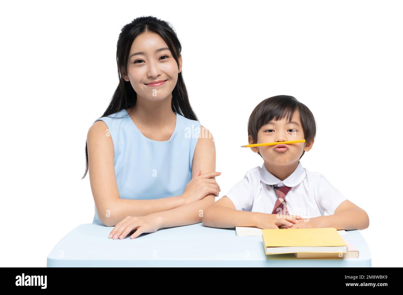 A young female teacher counseling boy learning Stock Photo - Alamy