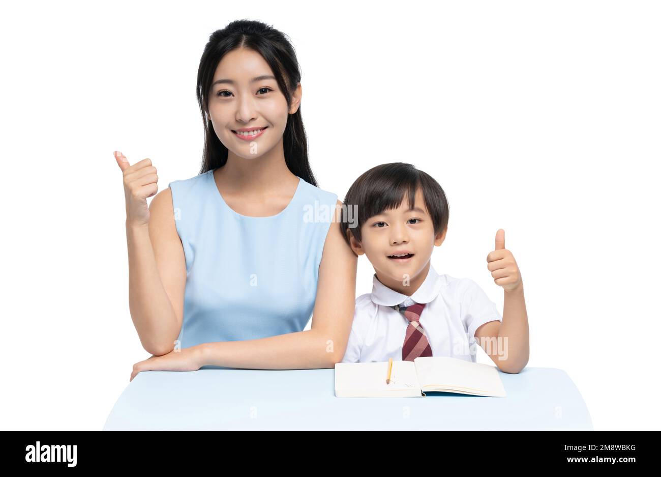 A young female teacher counseling boy learning Stock Photo - Alamy