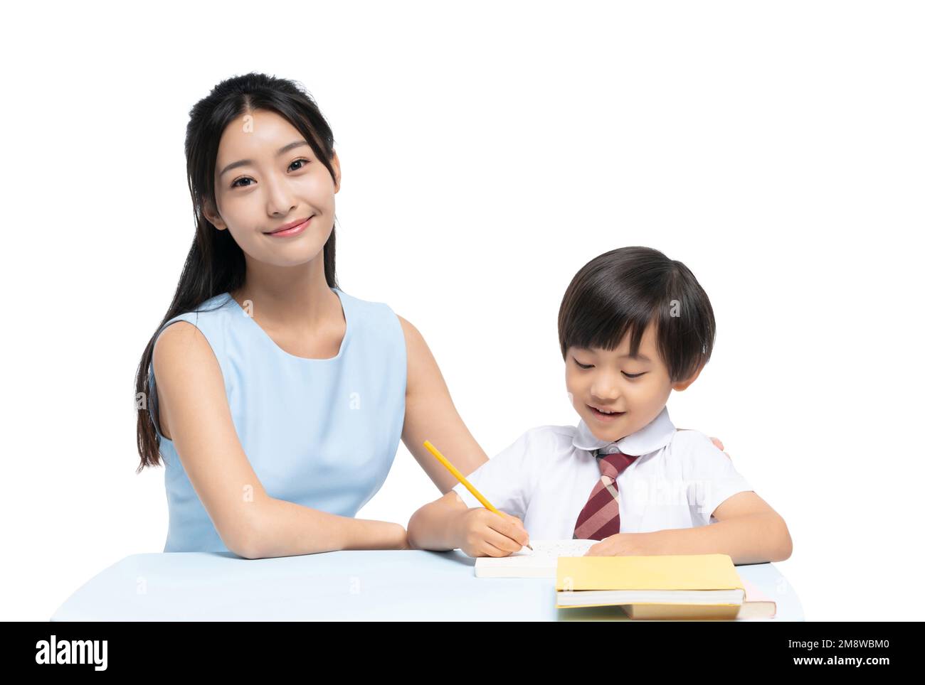 A young female teacher counseling boy learning Stock Photo - Alamy