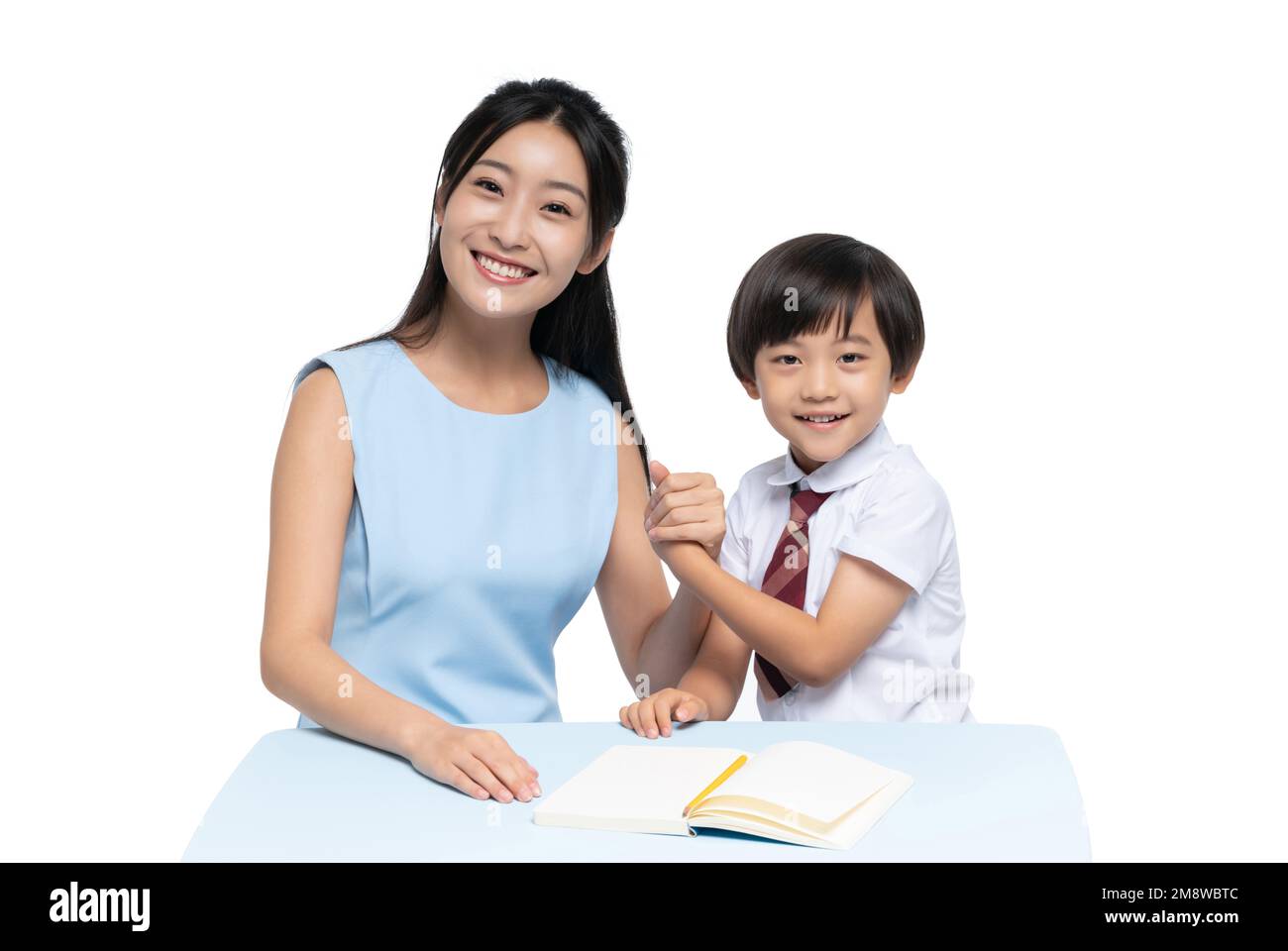 A young female teacher counseling boy learning Stock Photo - Alamy