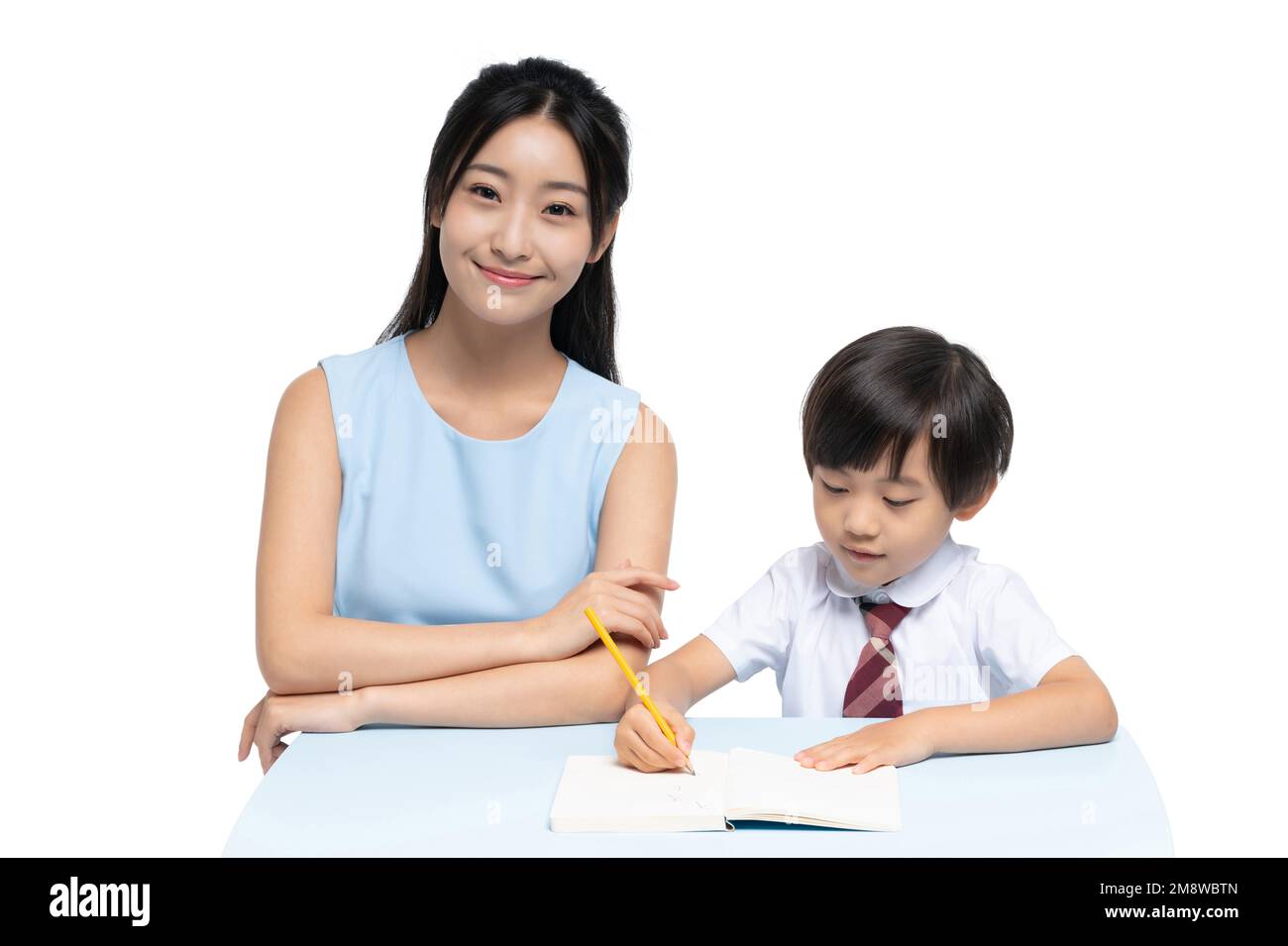 A young female teacher counseling boy learning Stock Photo - Alamy