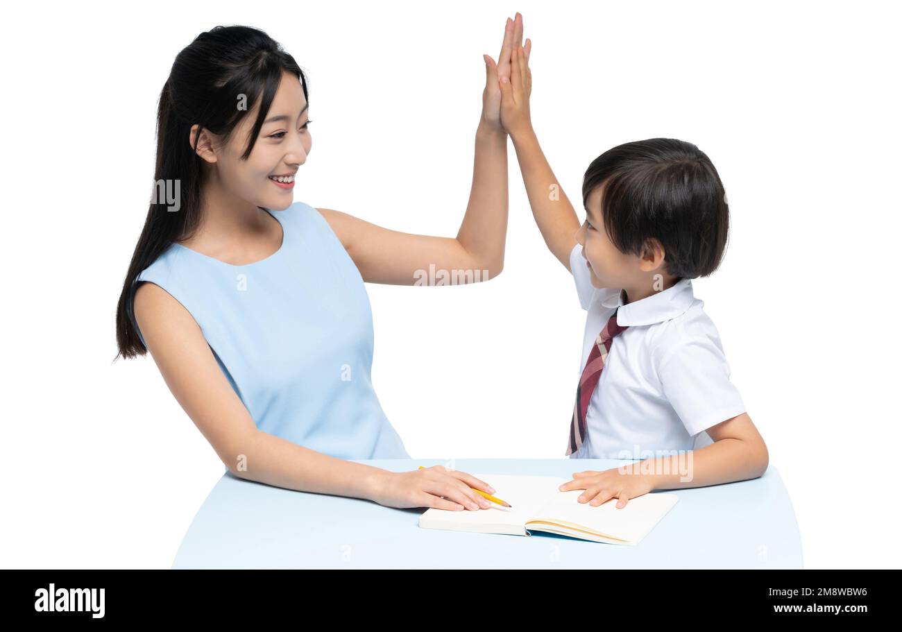 A young female teacher counseling boy learning Stock Photo - Alamy