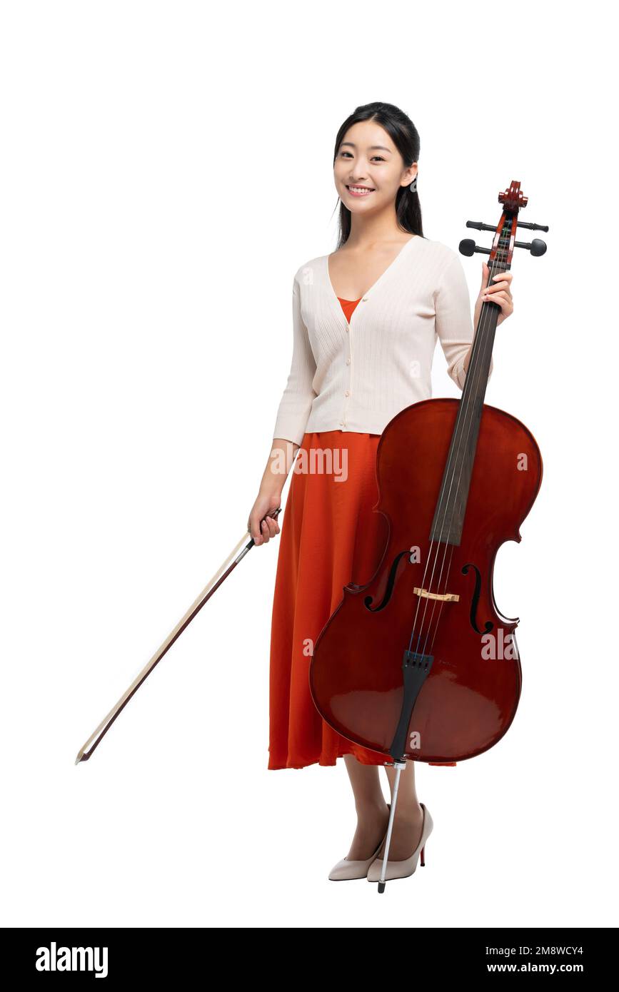 A young woman and the cello Stock Photo - Alamy