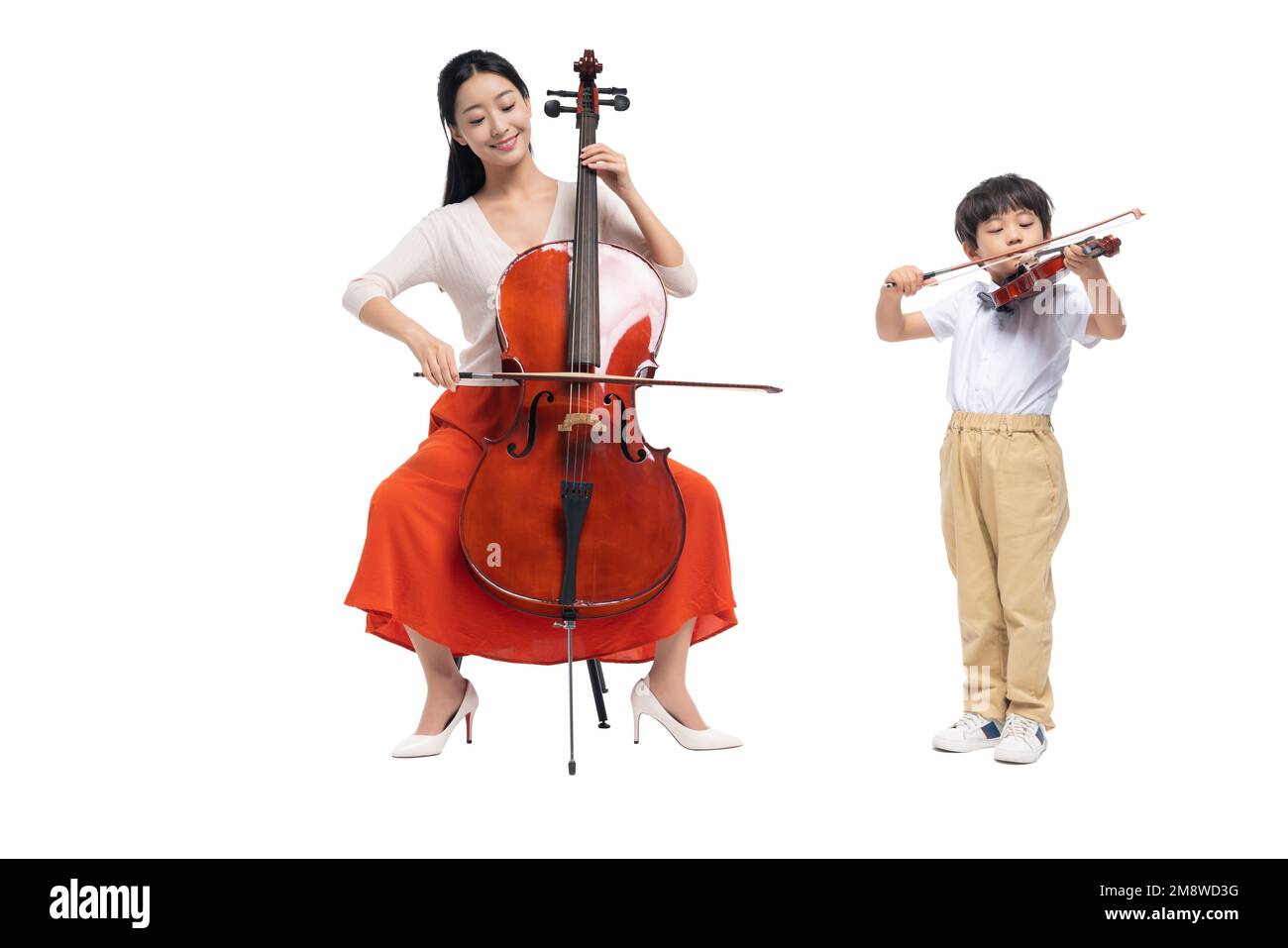 The female teacher guide the boy playing Musical Instruments Stock ...