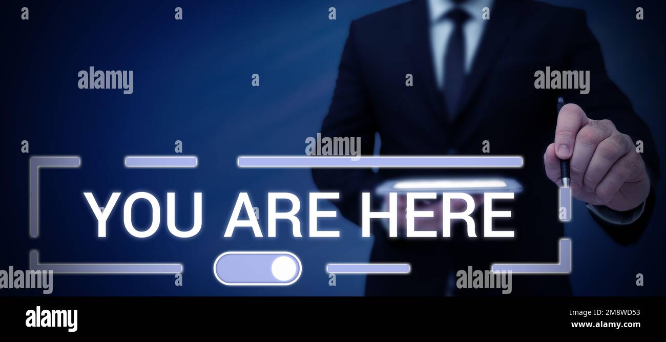 Hand writing sign You Are Here. Business idea This is your location ...