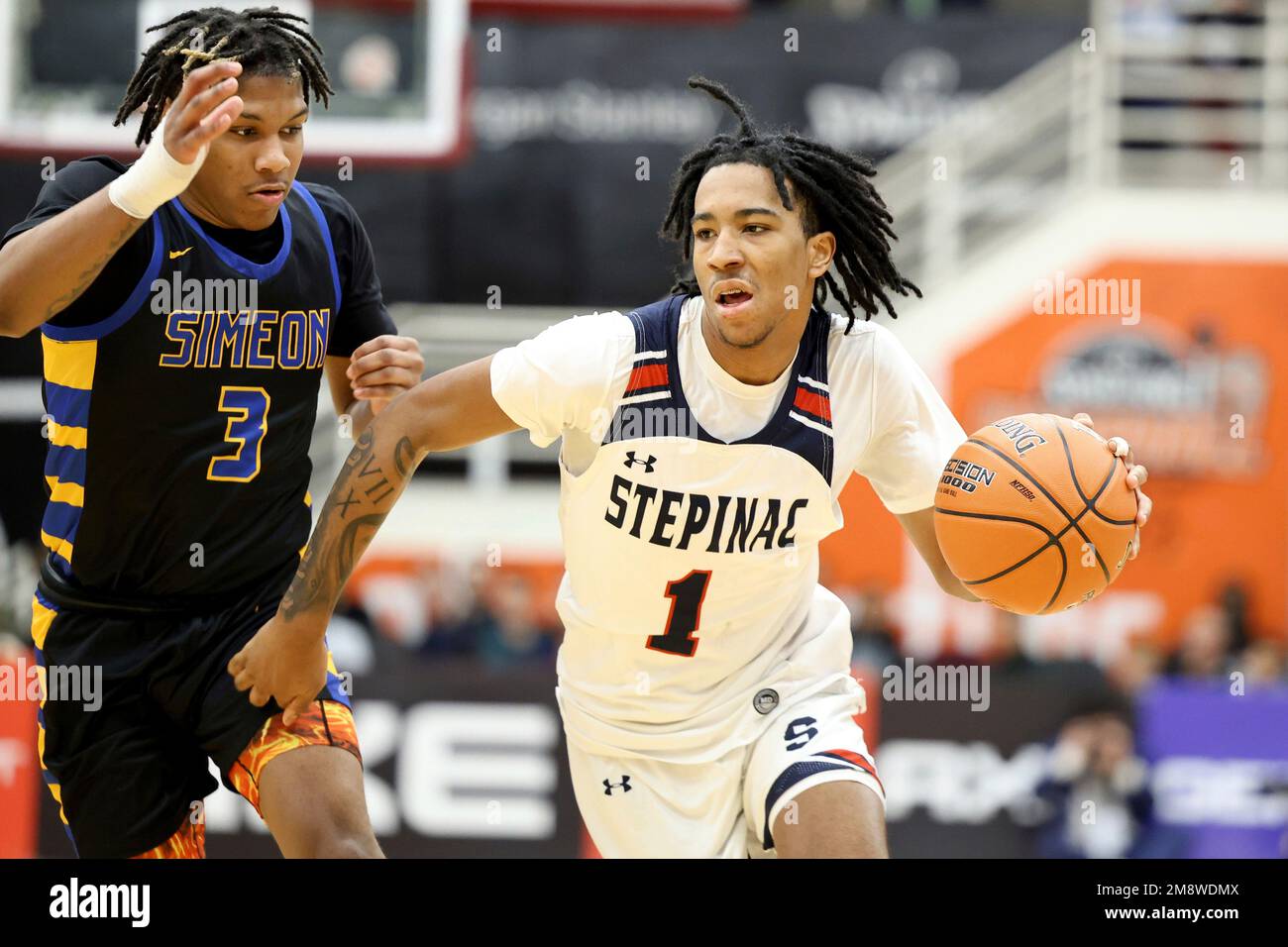 Stepinac's Boogie Fland #1 in action against Simeon during a high ...