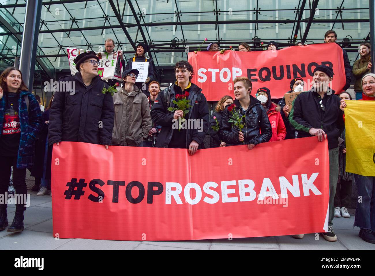 London, UK. 15th Jan, 2023. Protesters hold anti-fossil fuel banners ...