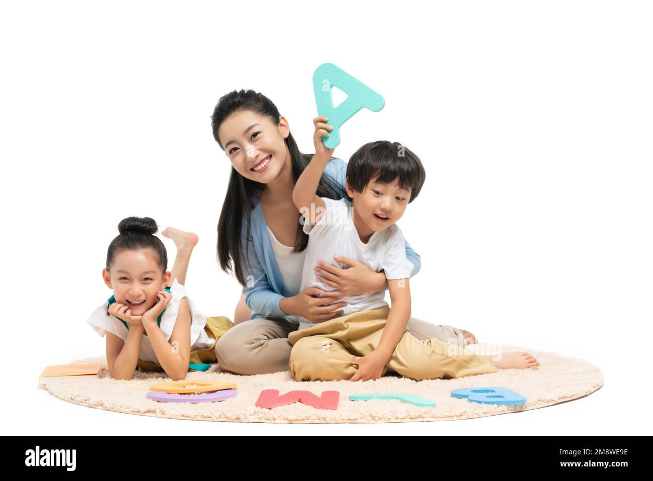 A young female teacher counseling students learning Stock Photo - Alamy