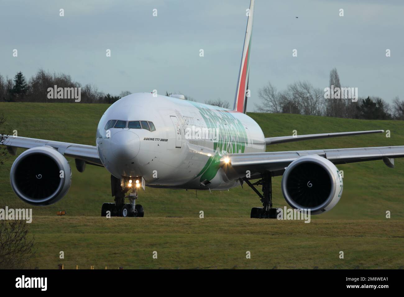 A Boeing 777-300ER passenger aircraft taxying at Birmingham airport, UK ...
