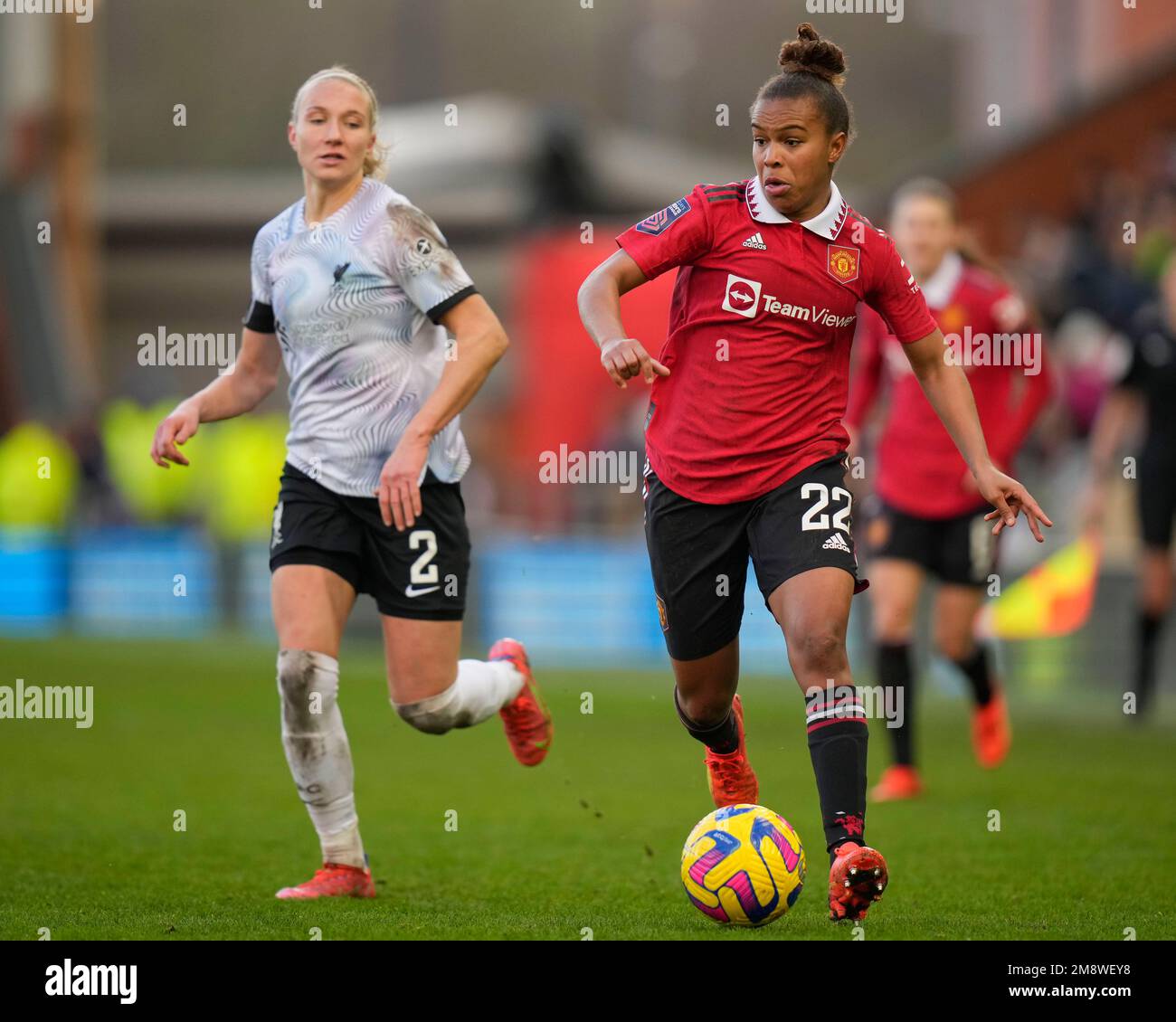 Nikita Parris #22 of Manchester United breaks past Emma Koivisto #2 of ...