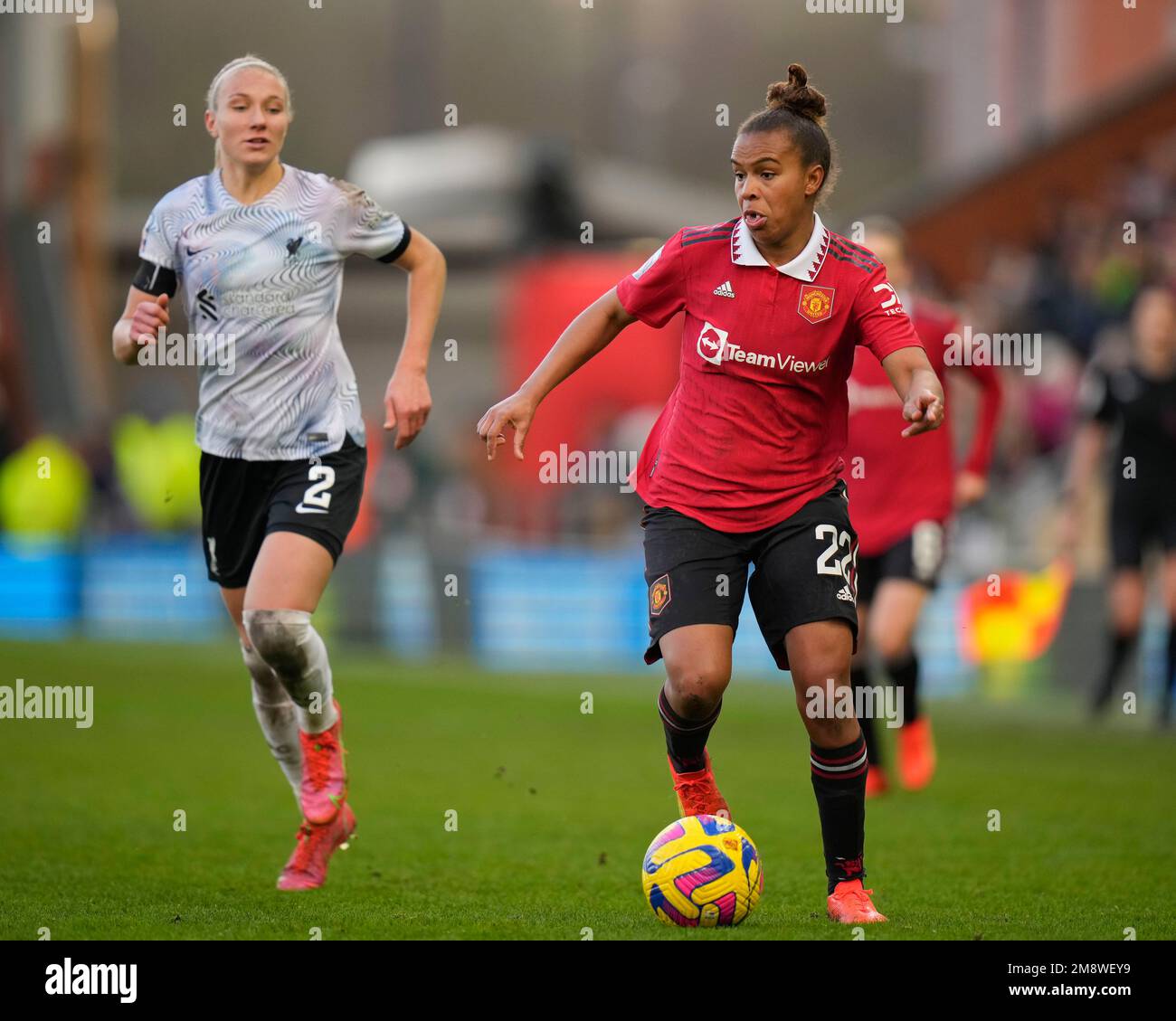Nikita Parris #22 of Manchester United breaks past Emma Koivisto #2 of ...