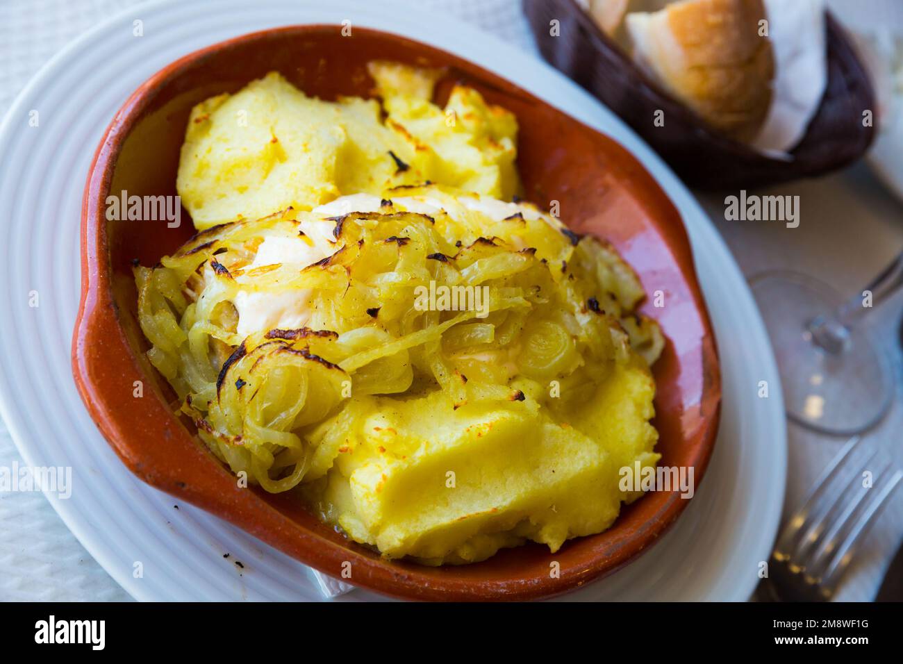 Cod steak baked with potato Stock Photo - Alamy