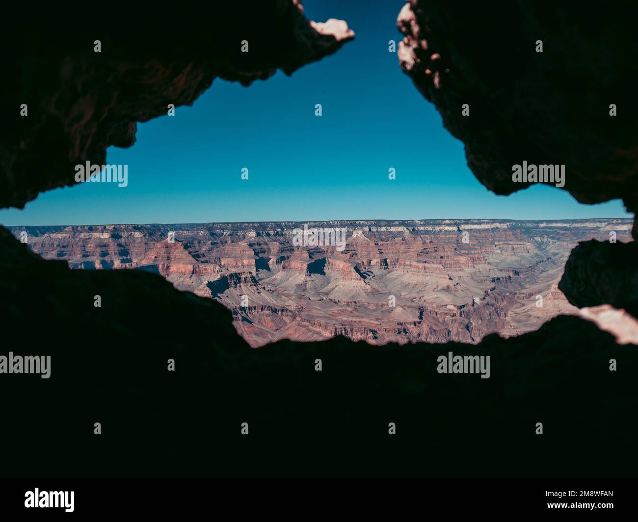 A landscape shot of the Grand Canyon from the perspective of a cave ...