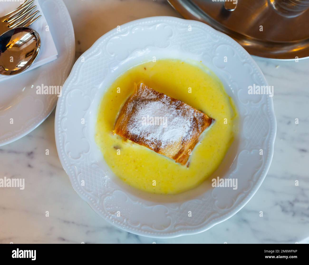 Popular confection is apple strudel with vanilla sauce Stock Photo - Alamy
