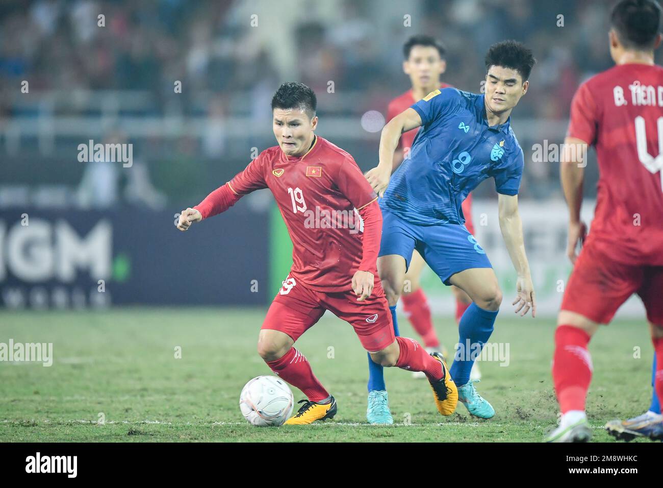 Hanoi, Vietnam. 13th Jan, 2023. Nguyen Quang Hai (L) of Vietnam and Peeradon Chamratsamee of ...