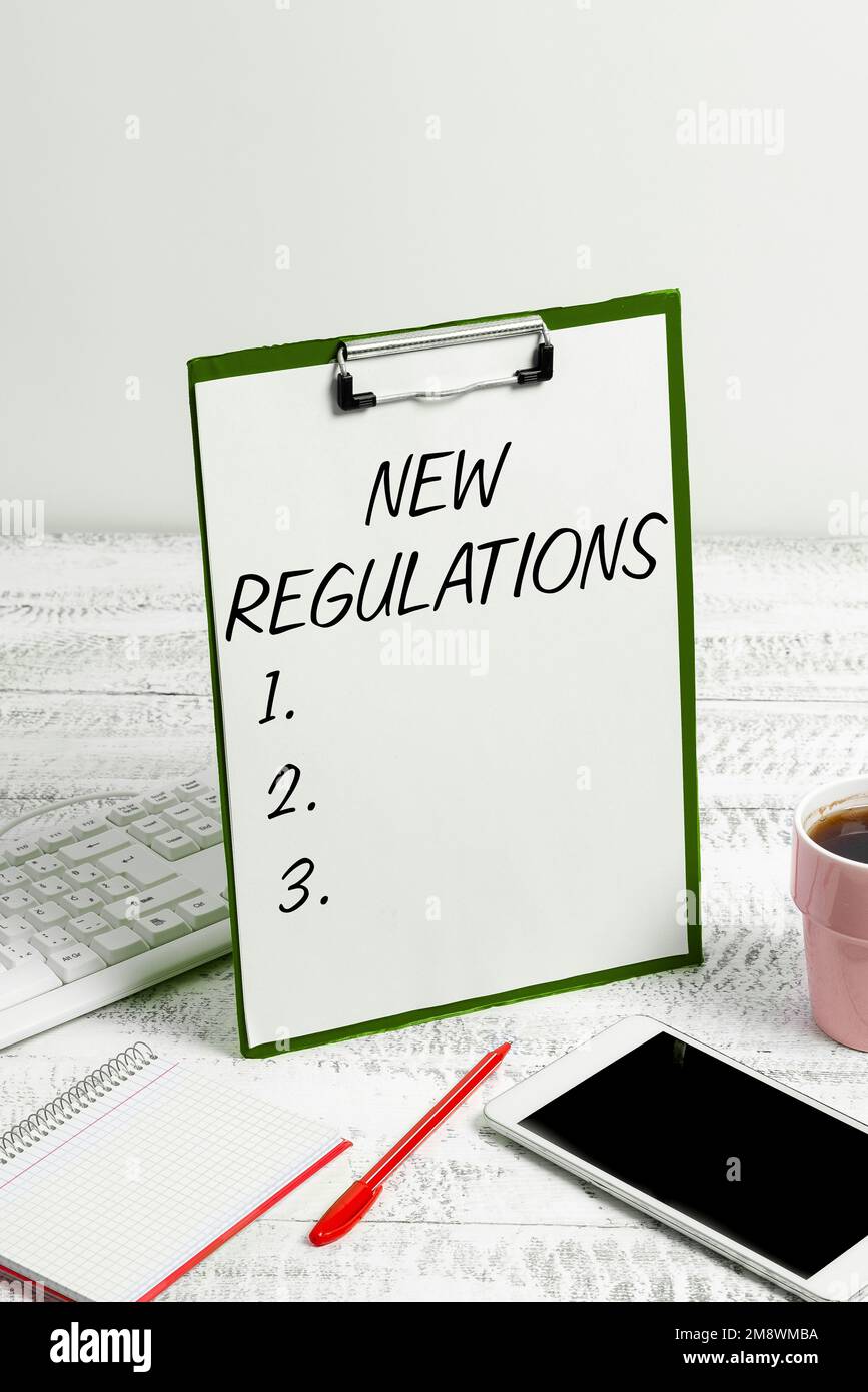Hand writing sign New Regulations. Word for Regulation controlling the ...