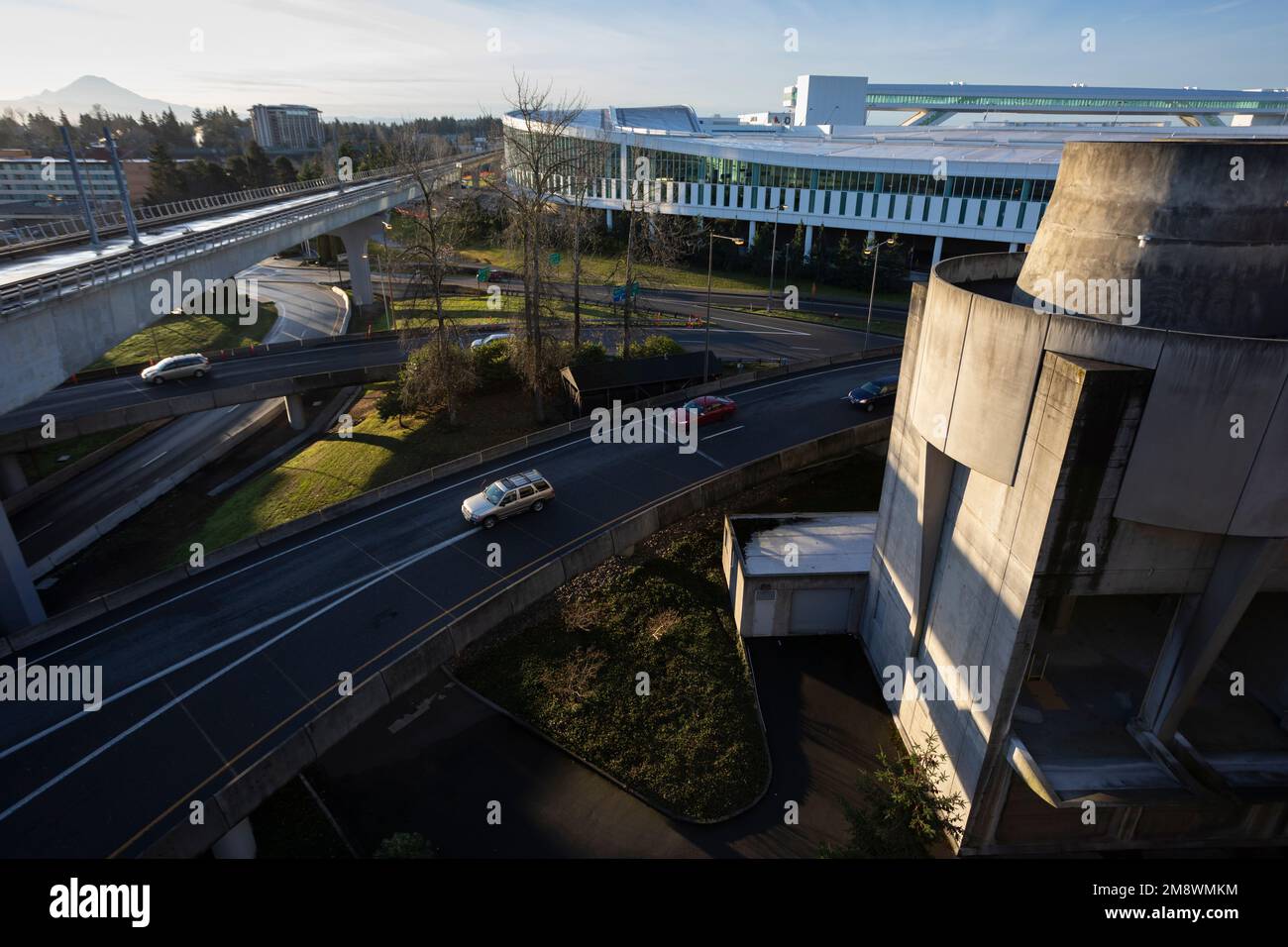 Cars exit the departures area as the sun rises at Seattle-Tacoma ...
