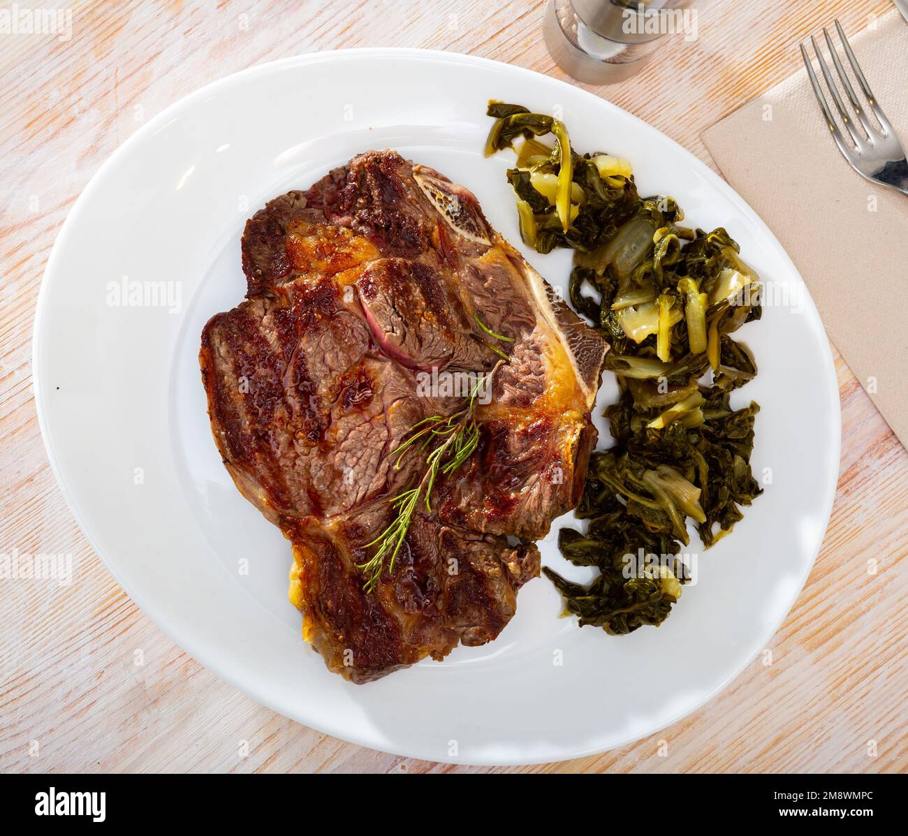 Top view on grilled beef with chard Stock Photo - Alamy
