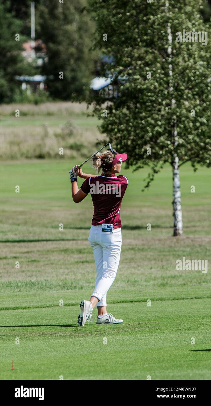 Professional Woman golfer playing golf Stock Photo - Alamy