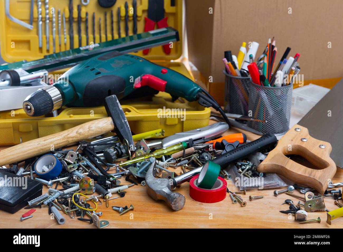 Different screws and tools on the table in the workshop Stock Photo - Alamy