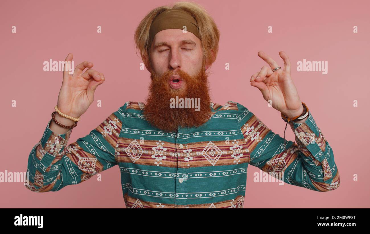 Keep calm down, relax, balance. Hippie redhead bearded man breathes ...