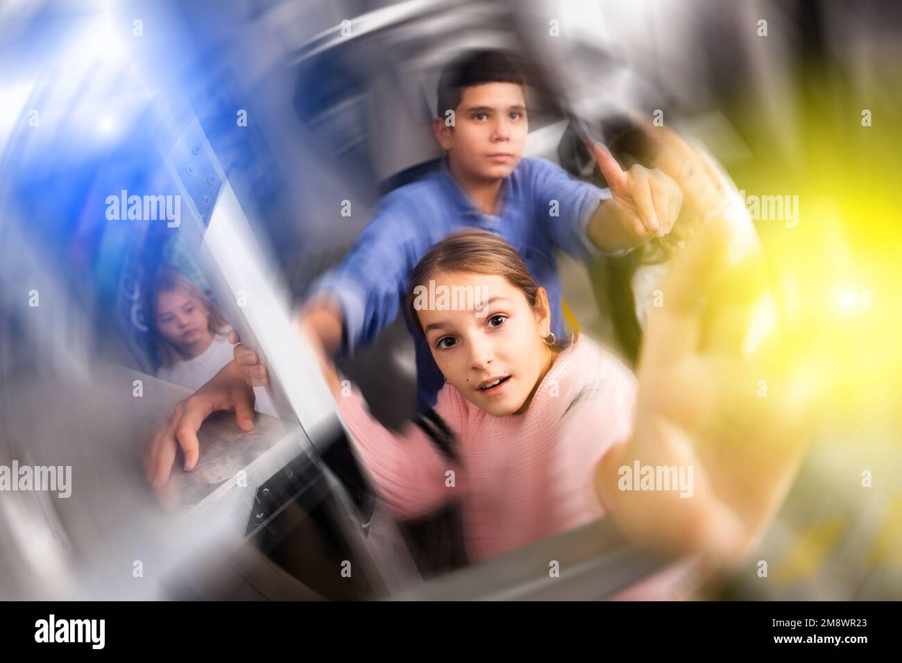 Tween children trying to solve riddles in quest room, toned image Stock ...