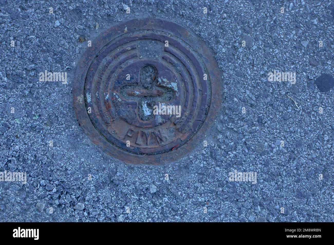 Manhole cover of the gas pipeline system. A massive metal hatch for ...