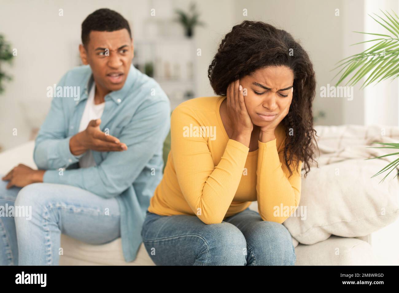 Sad crying young african american woman ignores angry aggressive ...