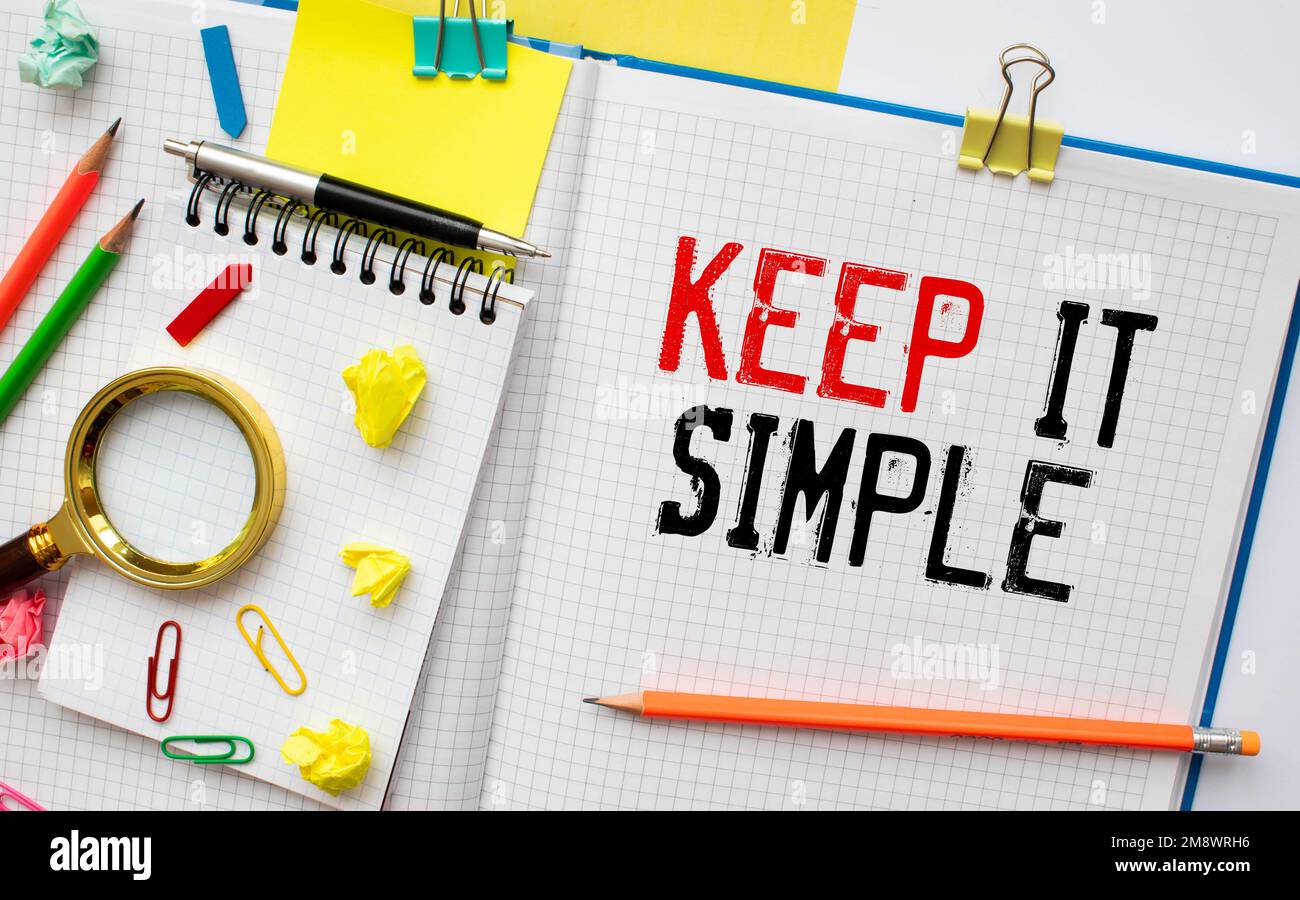 text Keep it simple on white paper Stock Photo - Alamy