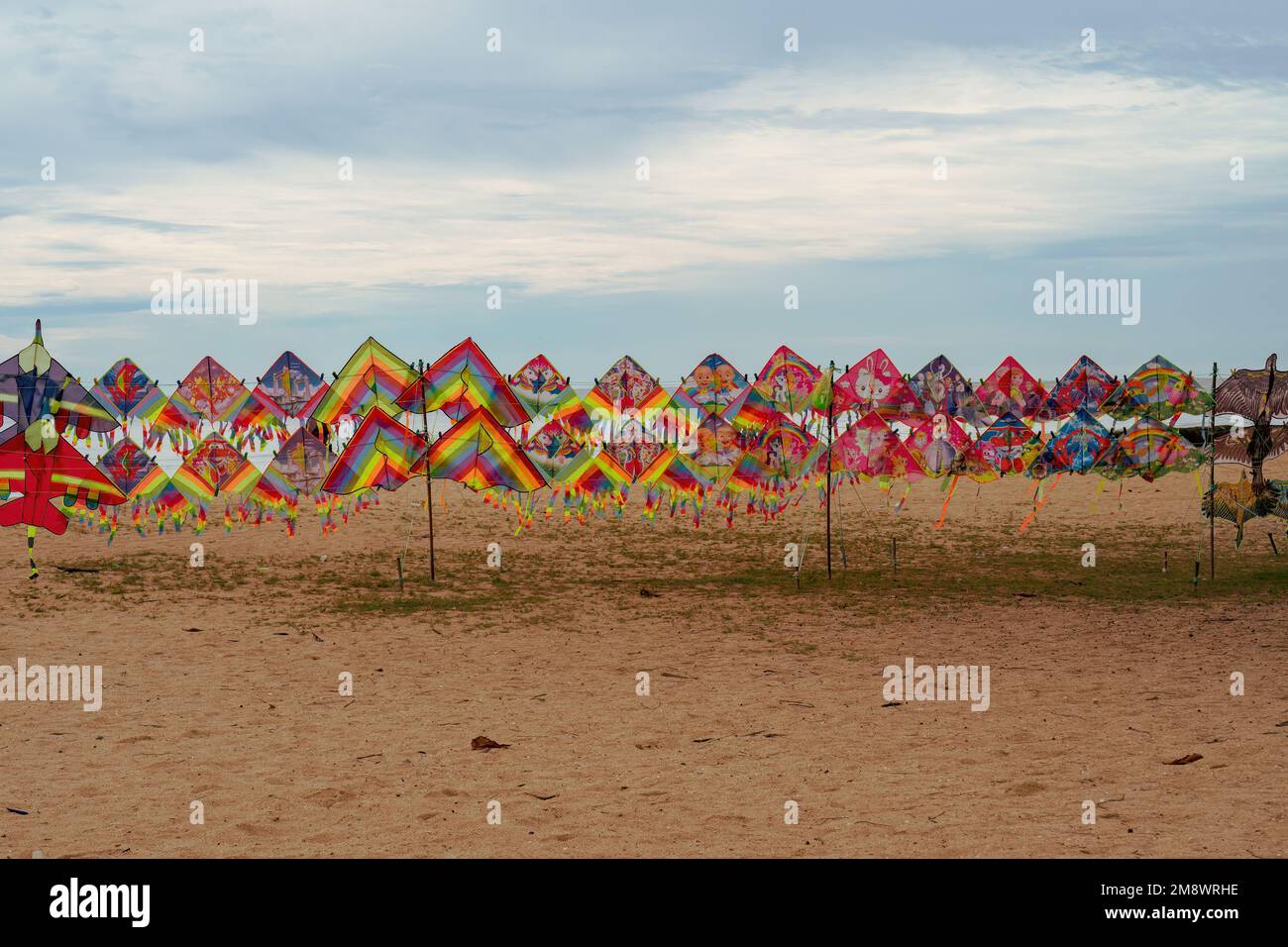 some Colourful kites on display for sale at the beach Stock Photo - Alamy