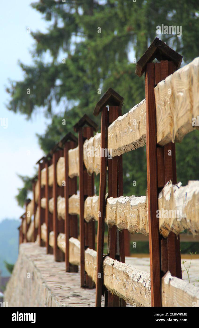 View Of Outgoing Wooden Railing On A Rock Foundation Stock Photo - Alamy