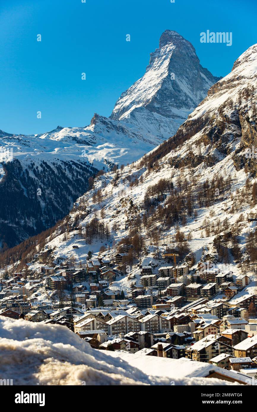Winter view of alpine township of Zermatt on background of snow-capped ...