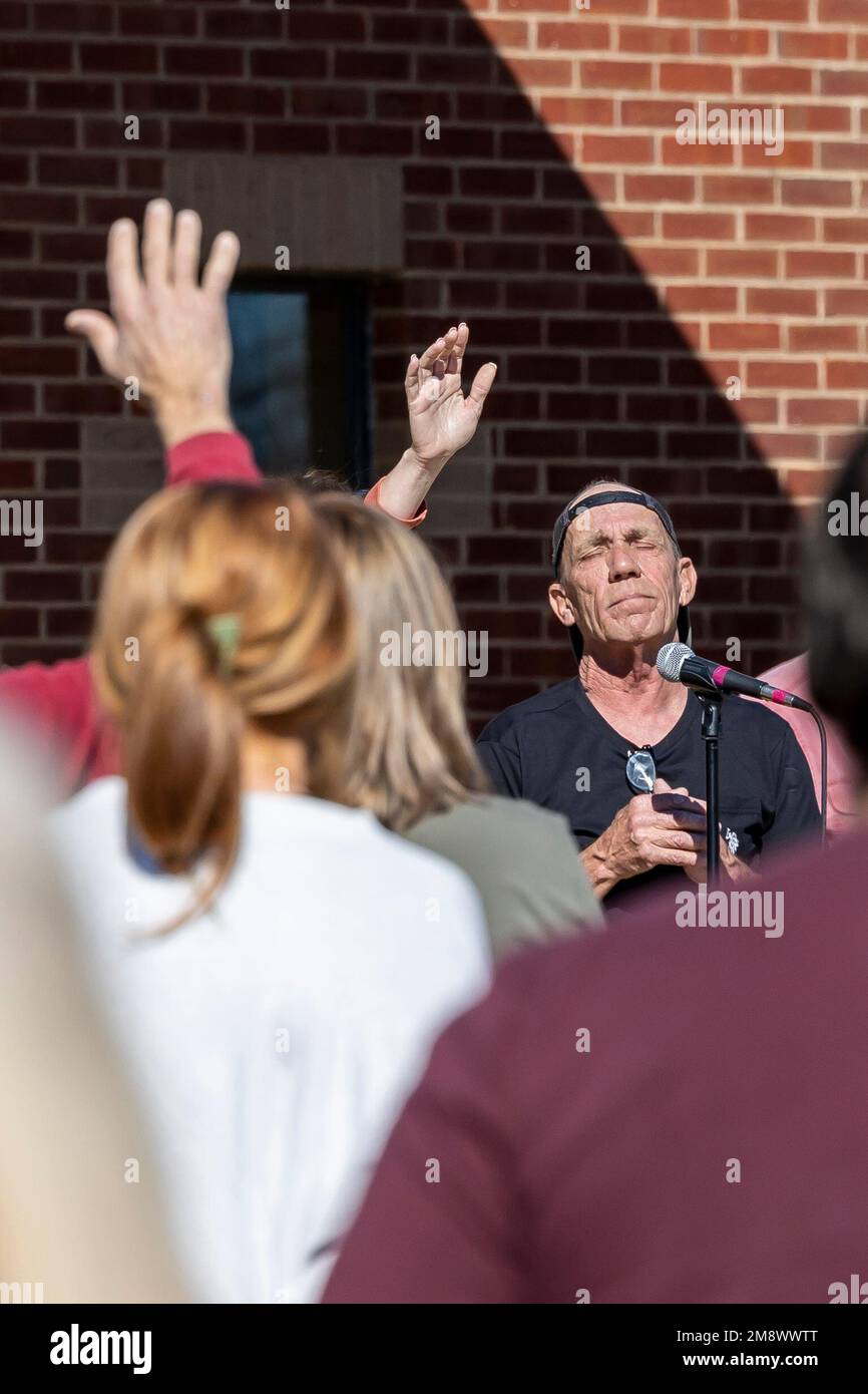 Tom Nichols, facing, sings as Crosspoint Christian Church holds its ...