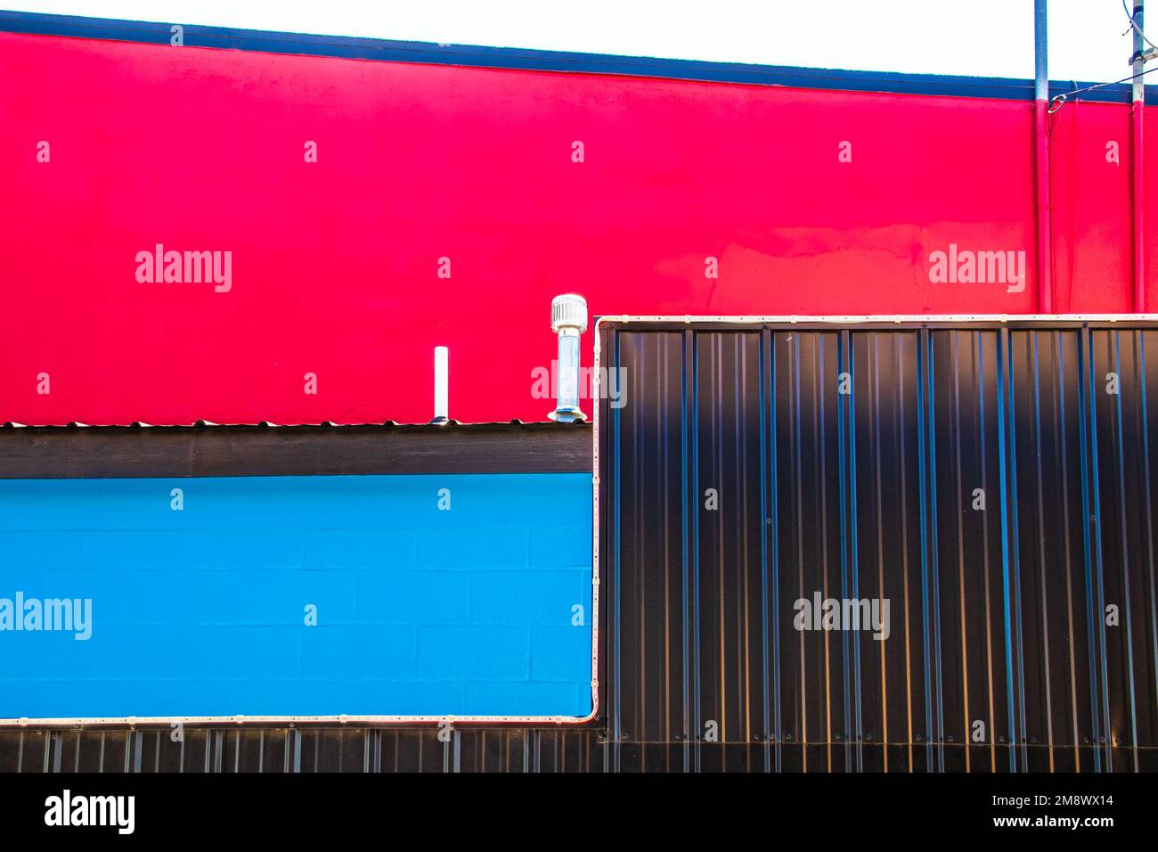 Color blocked buildings - Closeup industrial background Stock Photo - Alamy