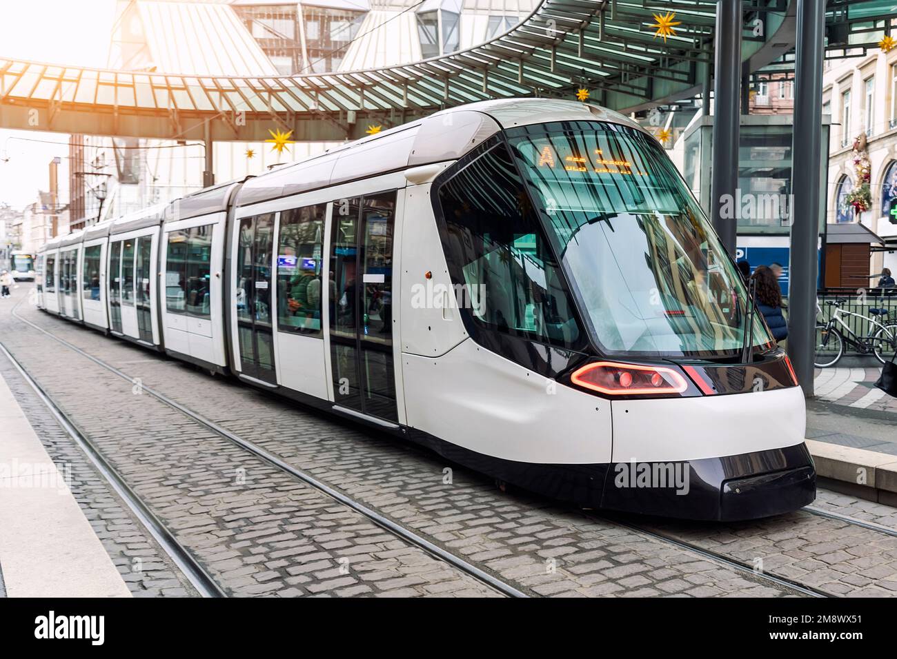 Modern tram streetcar at Kleber Central transport stop hub at Homme de ...